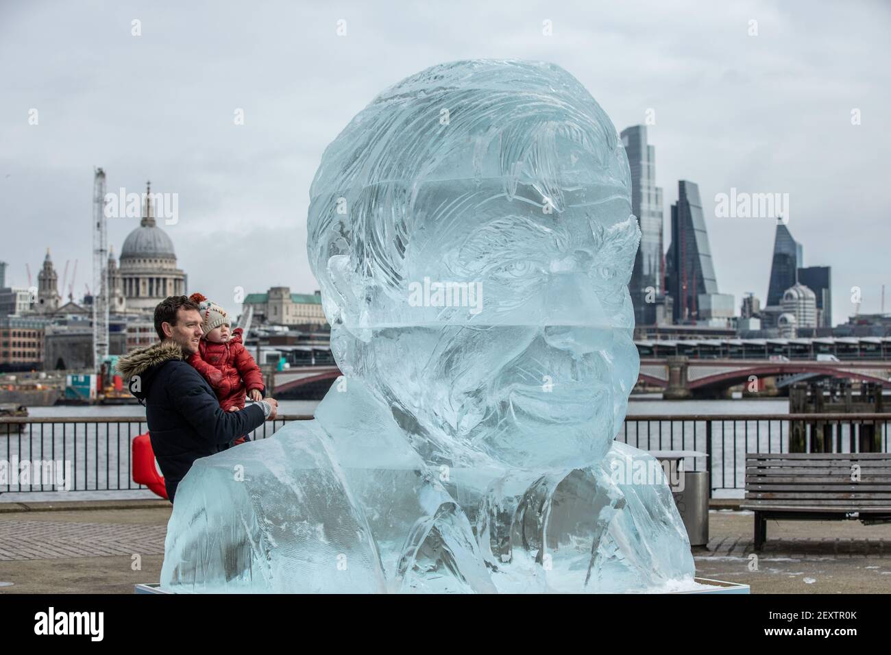A giant ice sculpture of Sir David Attenborough stands along the ...