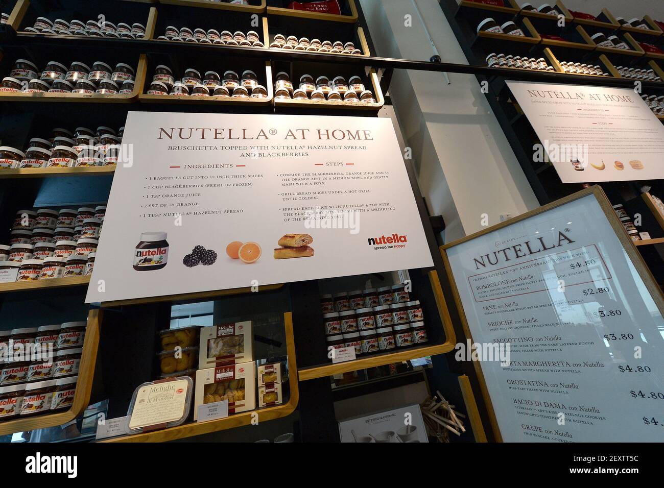 A row of Nutella jars, a hazelnut chocolate spread, lines the walls ...