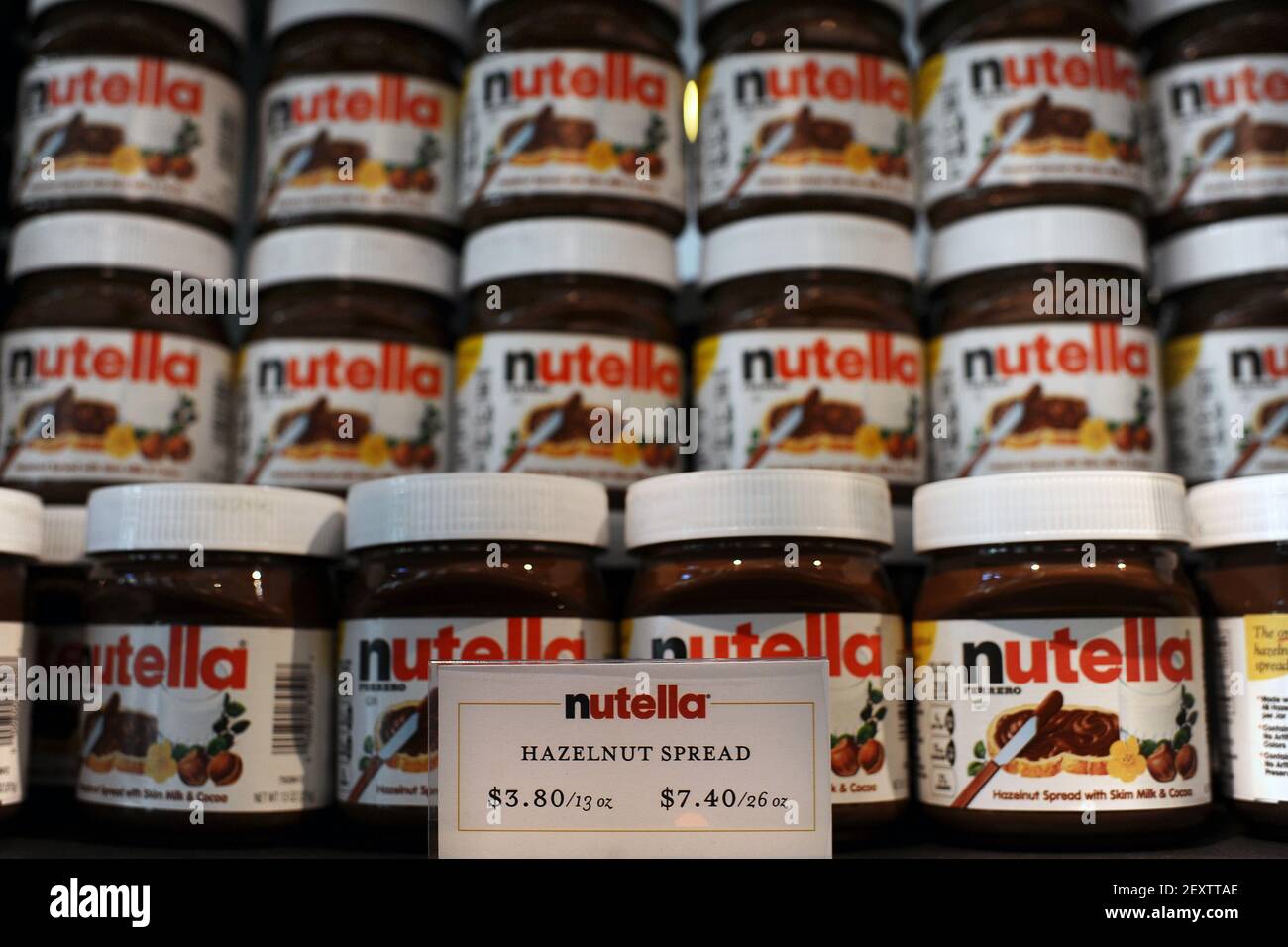 A row of Nutella jars, a hazelnut chocolate spread, lines the walls ...