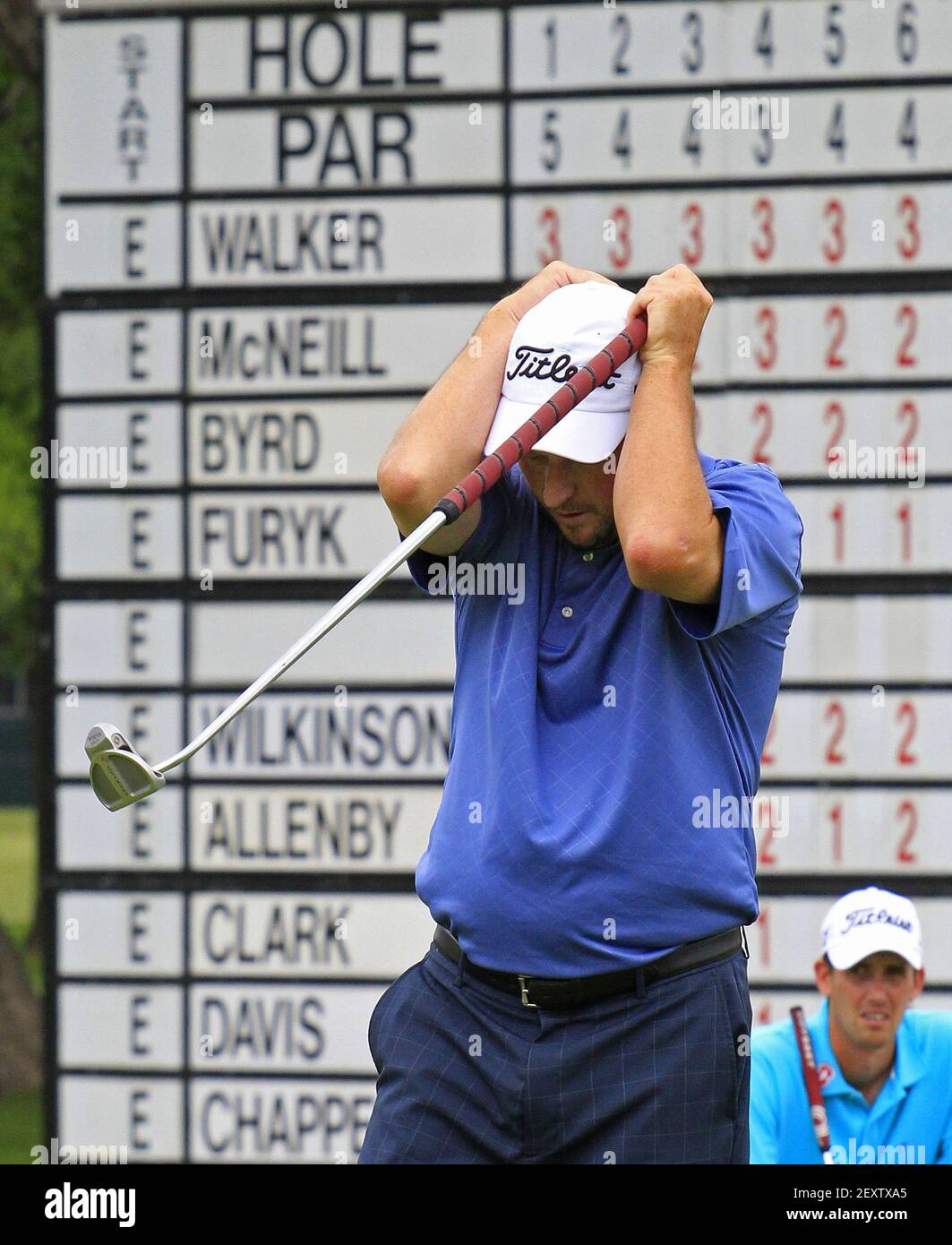 Tim Clark reacts to missing a birdie putt on the 18th green during the ...