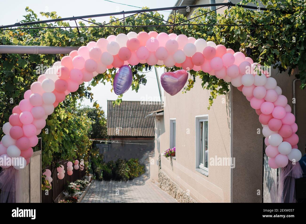Wedding arch made of colorful inflatable balloons. Celebration of a ...
