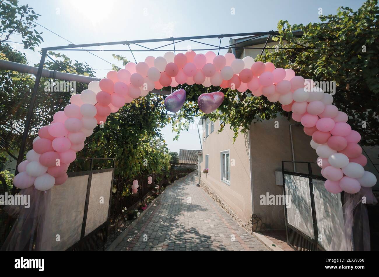 Wedding arch made of colorful inflatable balloons. Celebration of a ...
