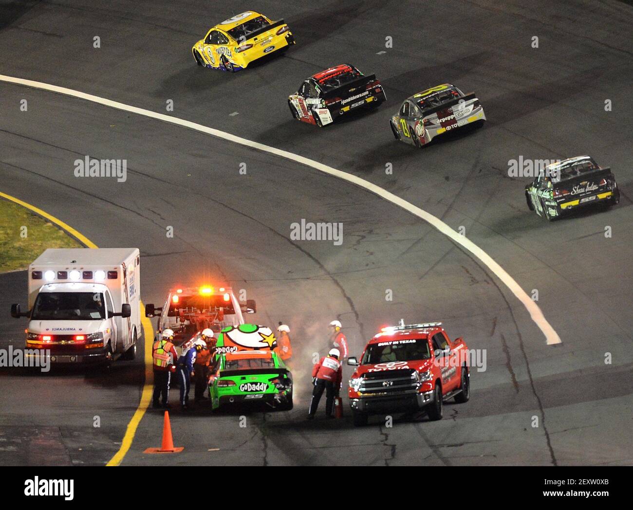 NASCAR Sprint Cup Series driver Danica Patrick (10) is tended to by ...