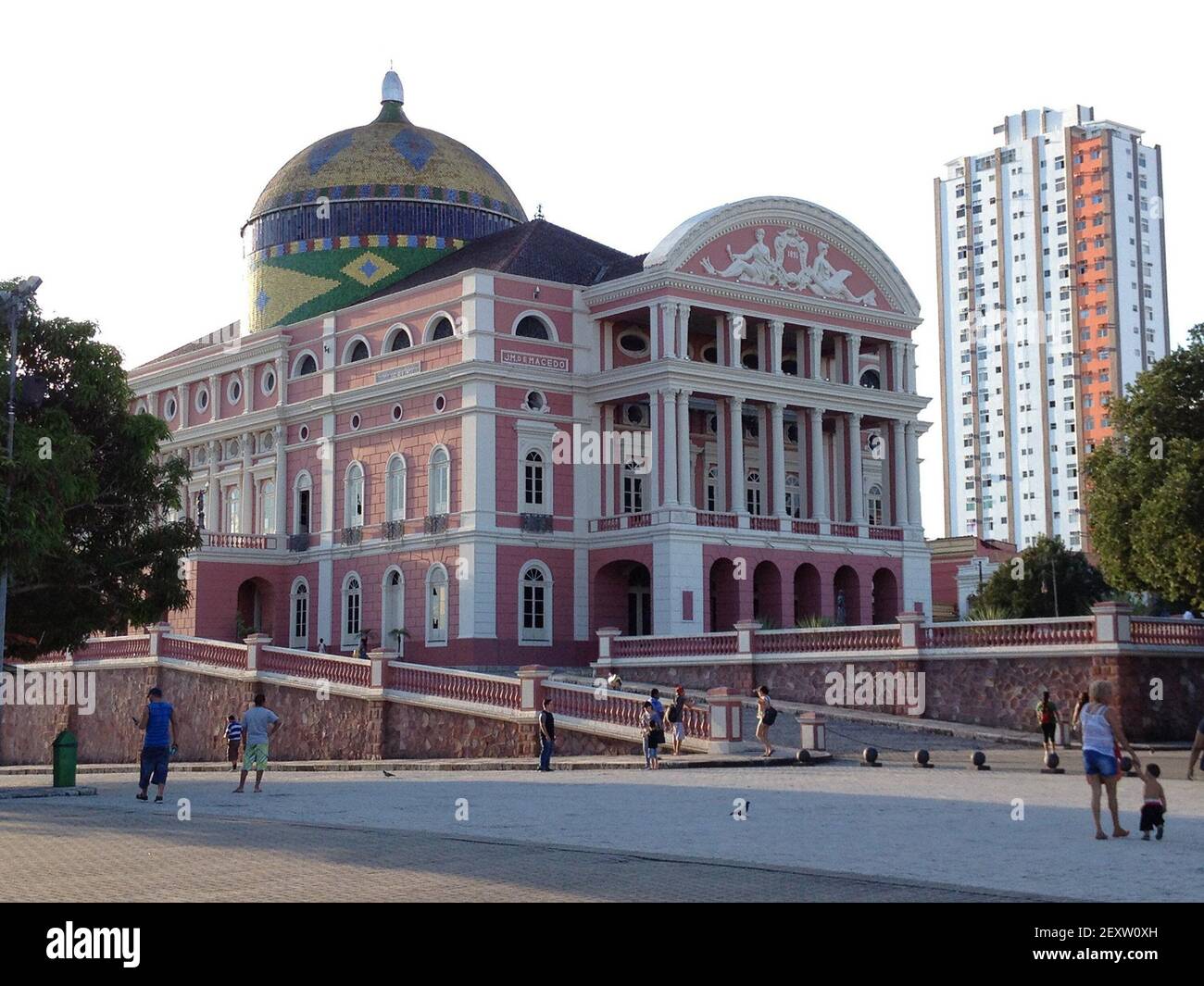 A modern high rise shares the skyline with the old opera house in ...