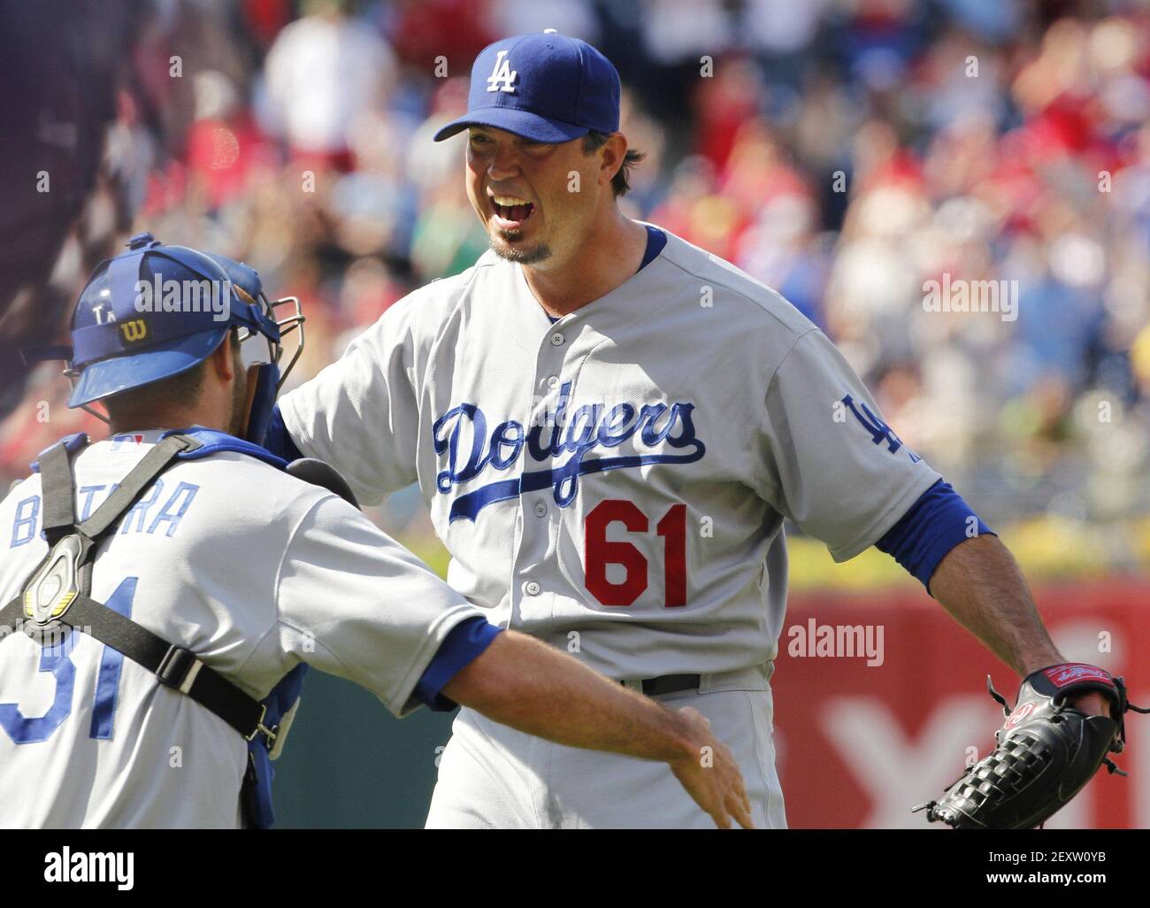 Los Angeles Dodgers' Josh Beckett celebrates with catcher Drew Butera ...