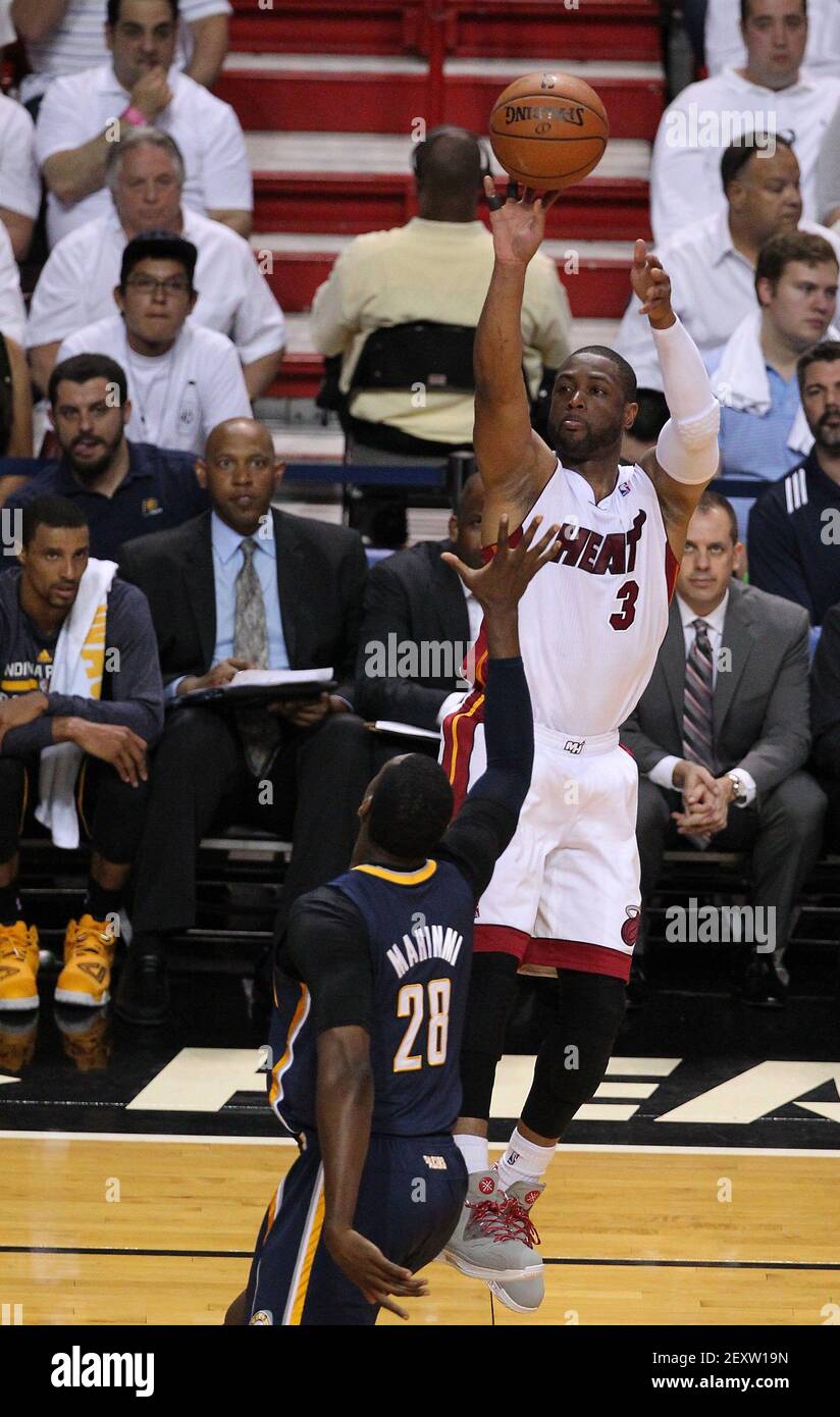 Miami Heat guard Dwyane Wade shoots over Indiana Pacers center Ian ...