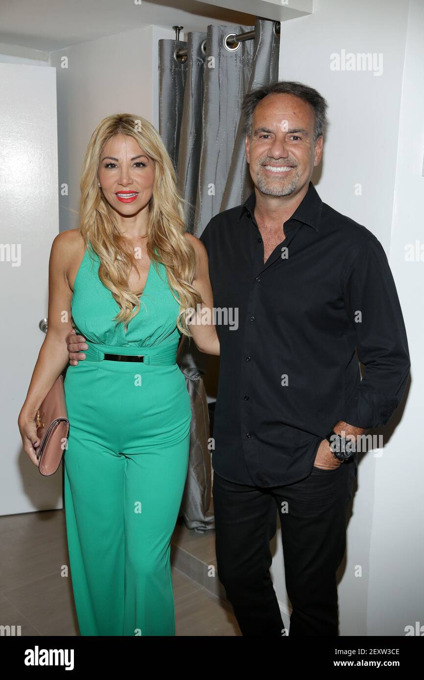 Roxana Garcia and Abraham Vivas are seen during the grand opening of ...