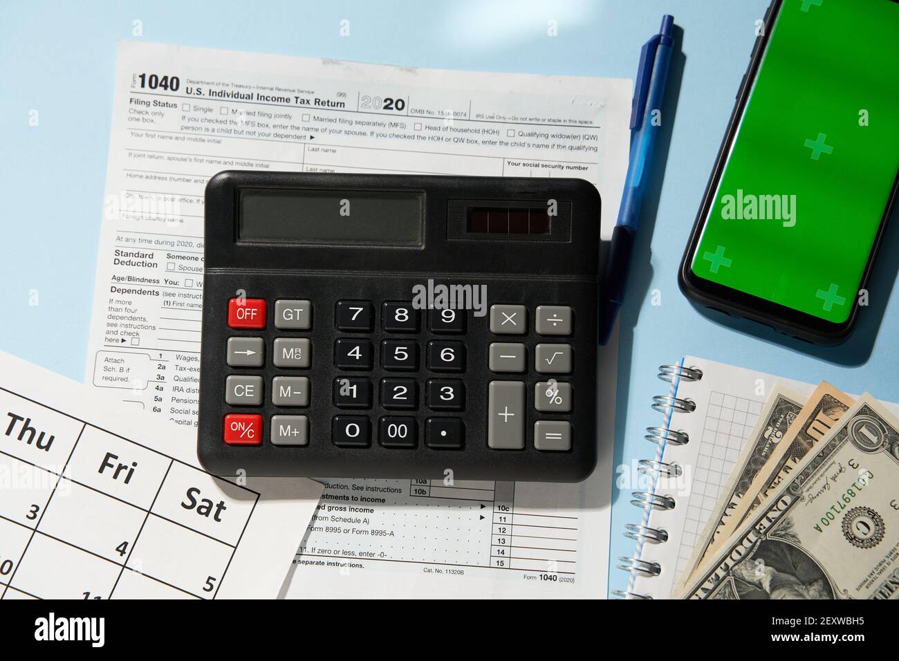 Financial time tax form, mobile with green screen and calculator ...