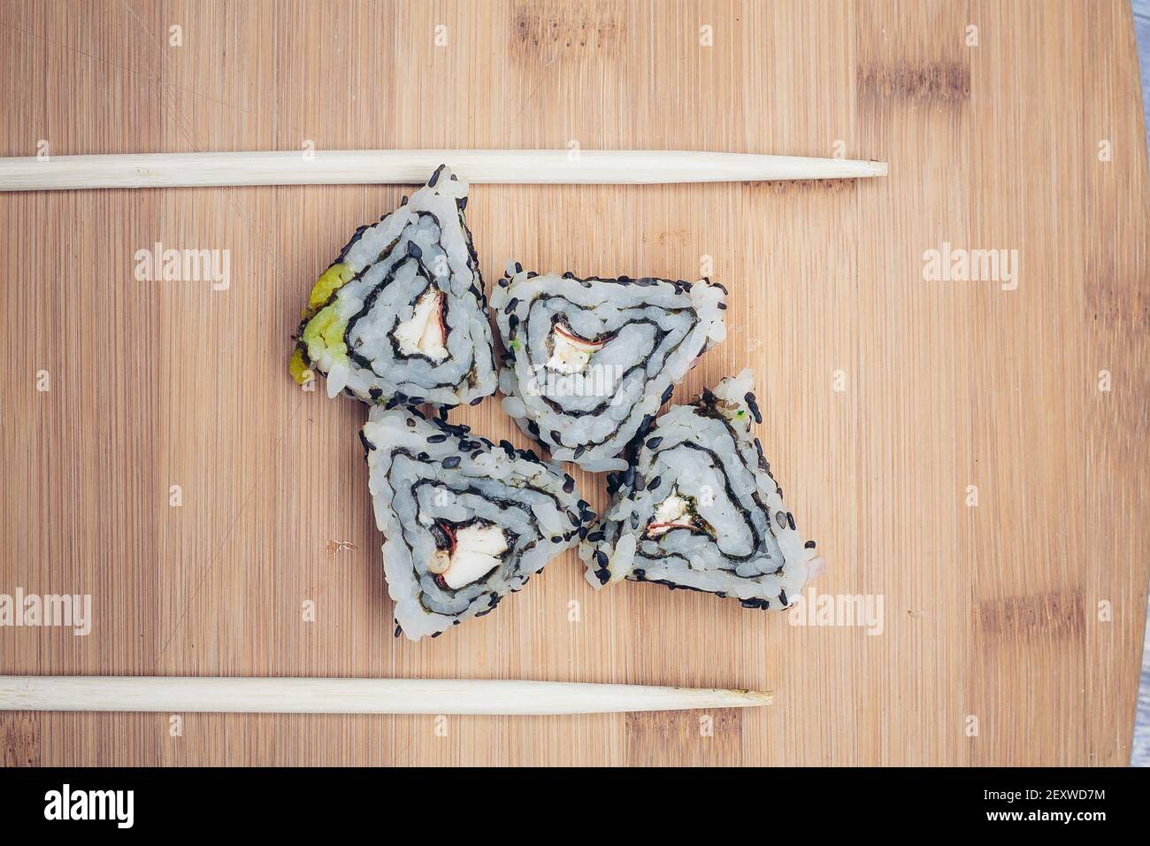 triangular sushi rolls chopsticks wooden background asian cuisine Stock ...