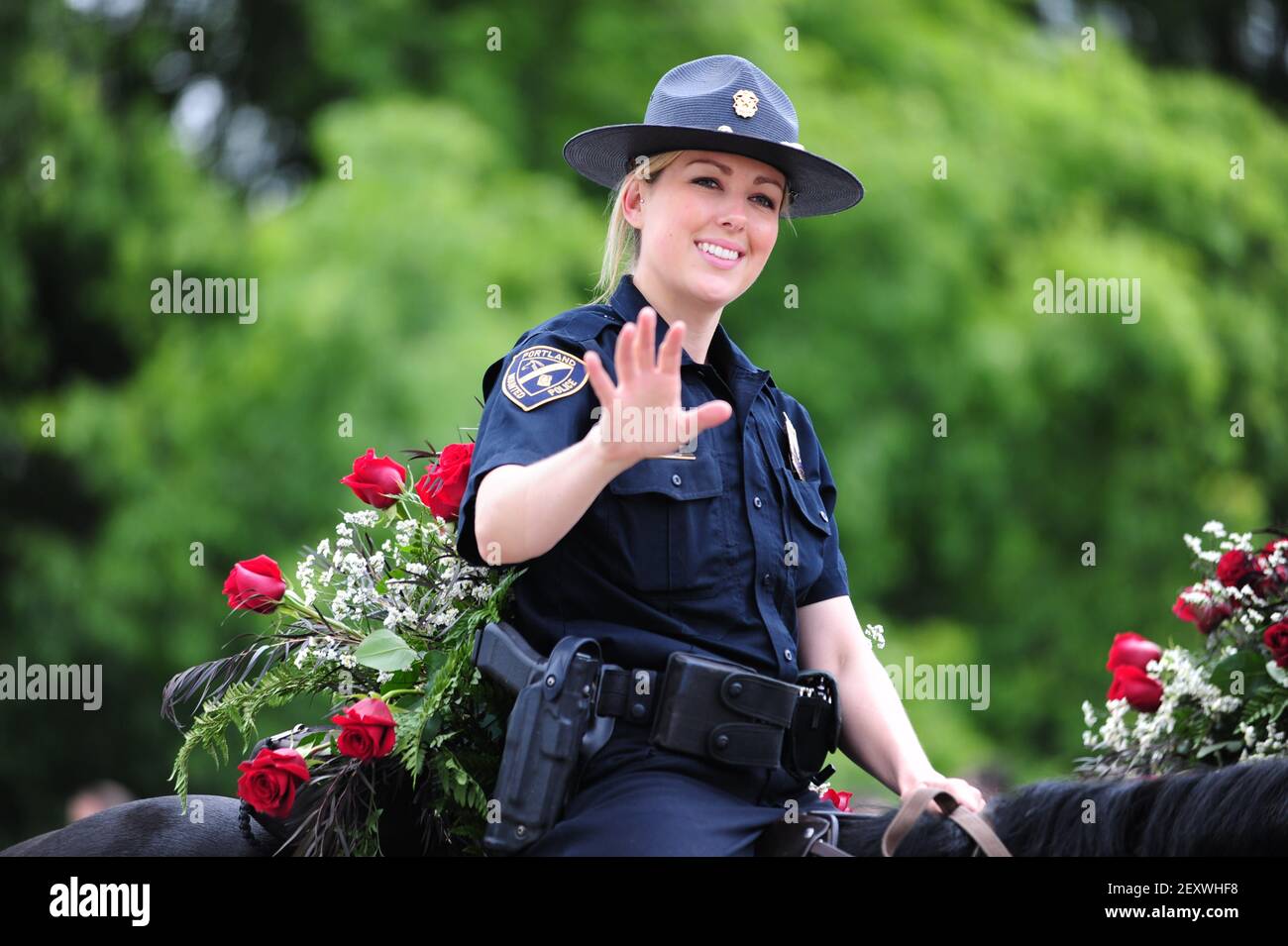 A Portland police officer horseback takes part in the Grand Floral ...