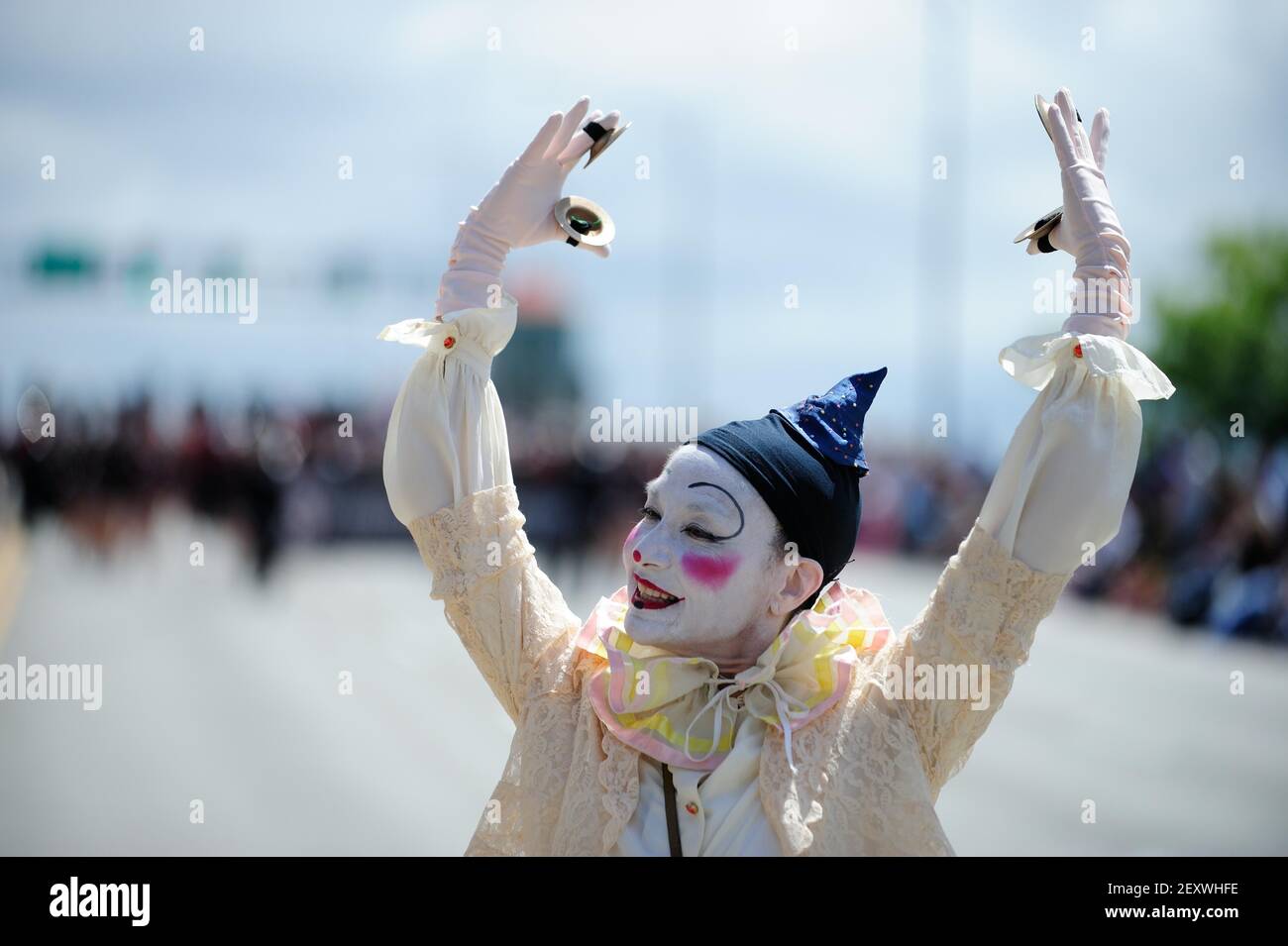 A clown passes over the Burnside Bridge during the Grand Floral Parade ...