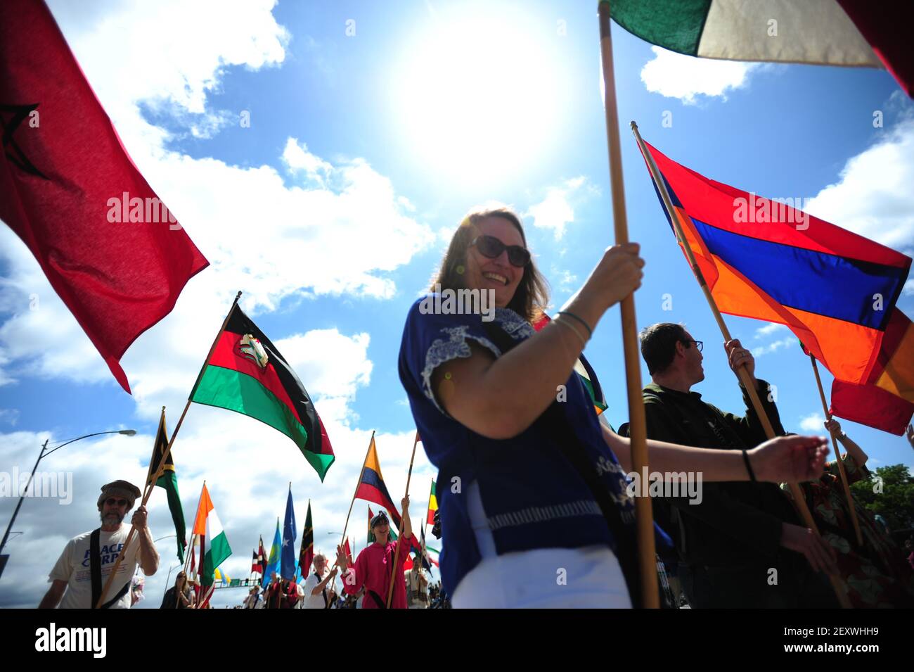 People carrying flags from around the world make their way over the ...