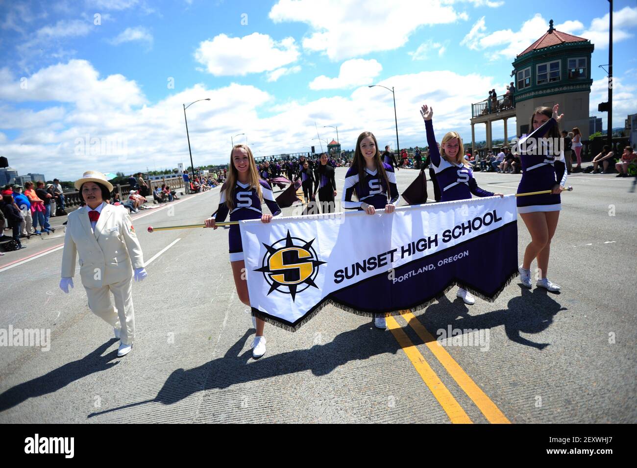 Sunset high school cheerleaders make their way over the Burnside Bridge ...