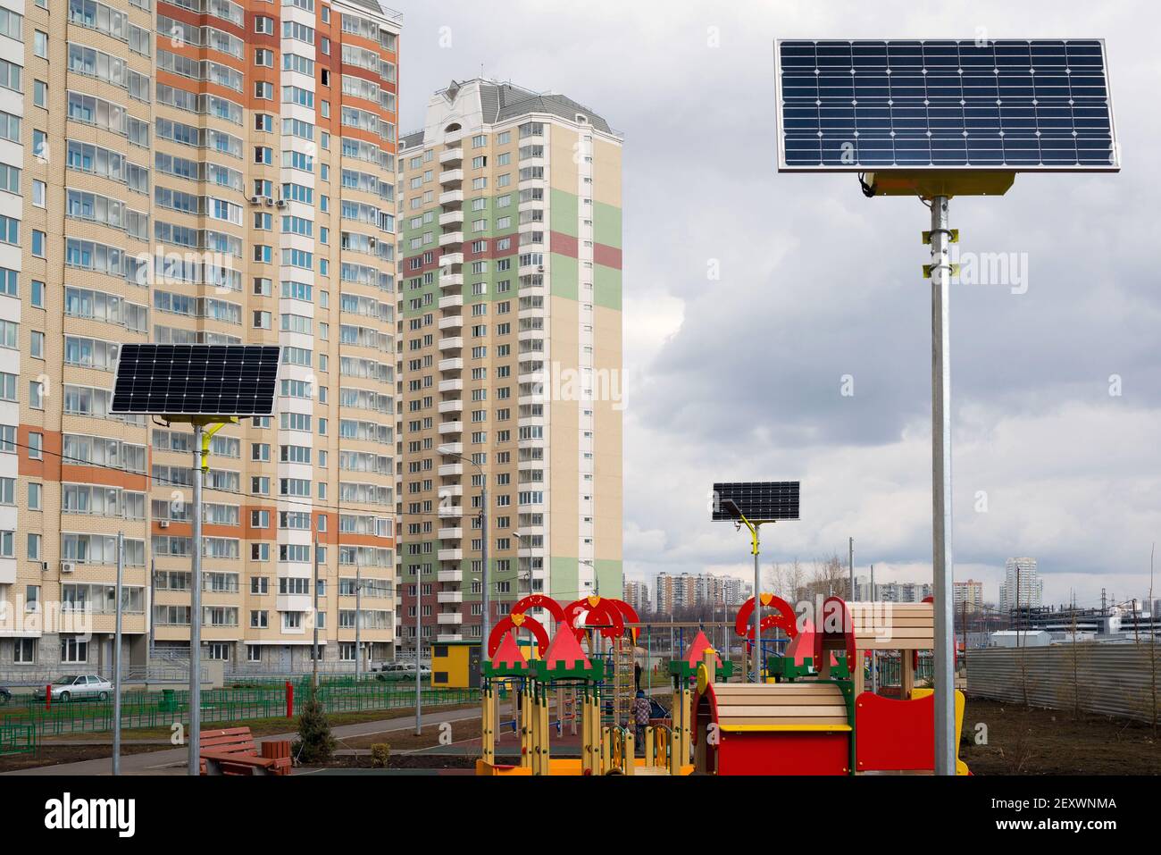 Children's playground in the courtyard of an apartment house with solar ...