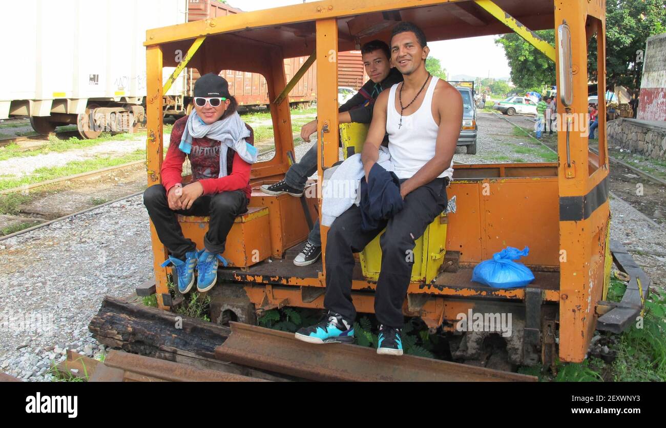 Three Honduran migrant rest in the railyard in Arriaga, Mexico, waiting ...