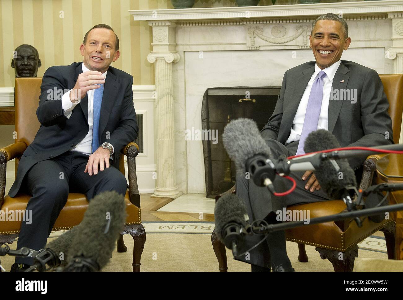 United States President Barack Obama, right, meets reporters following ...