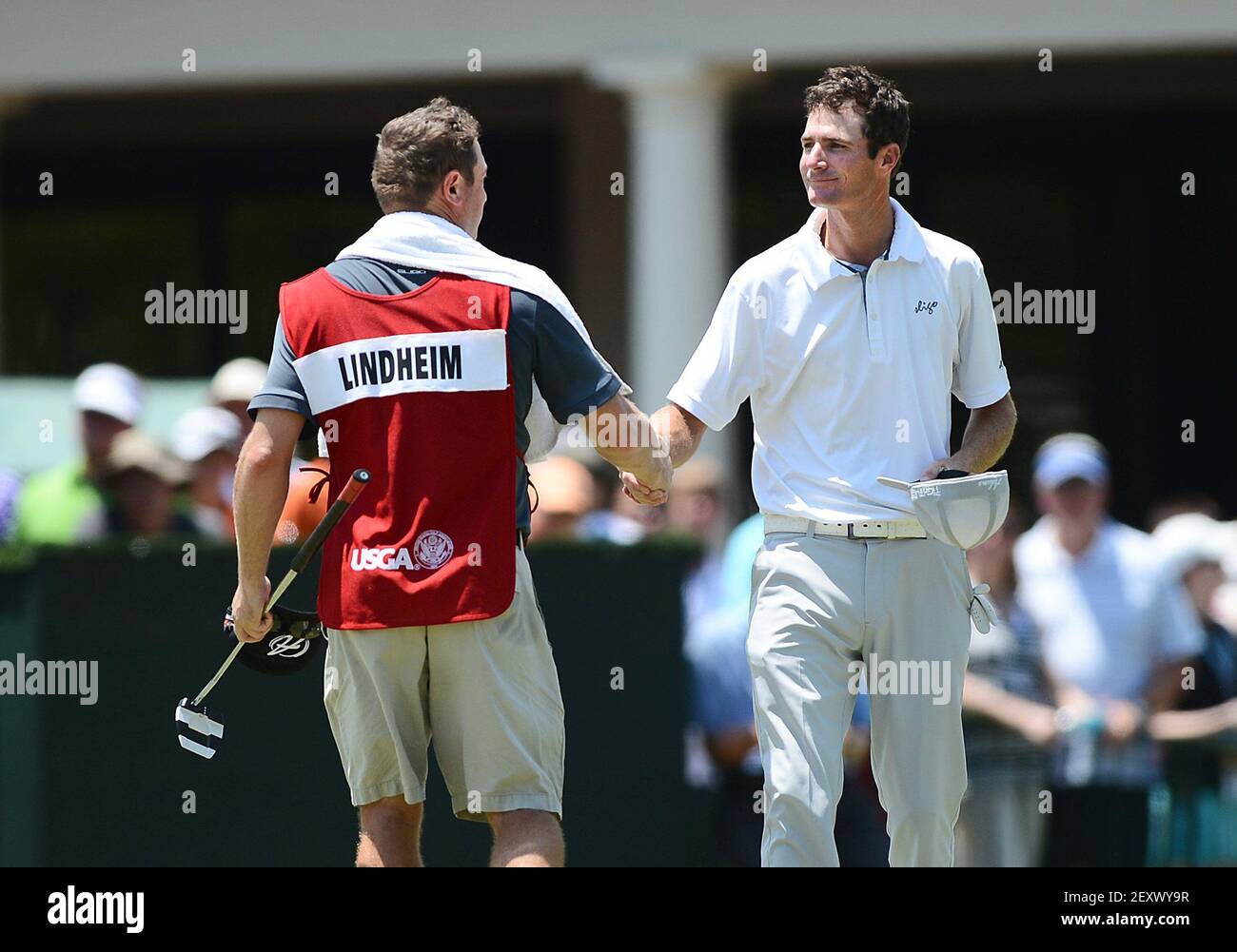 Nicholas Lindheim, right, shakes hands with his caddie, Carter ...