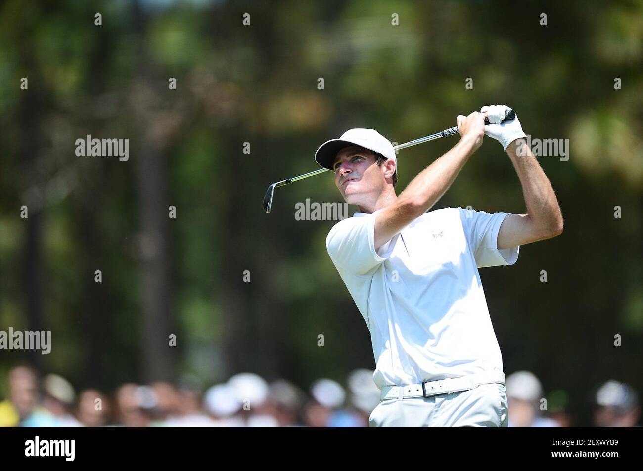 Nicholas Lindheim follows through on his drive from the 17th tee box ...