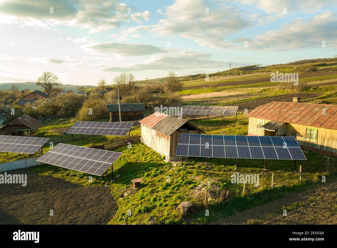Aerial top down view of solar panels in green rural village yard Stock ...