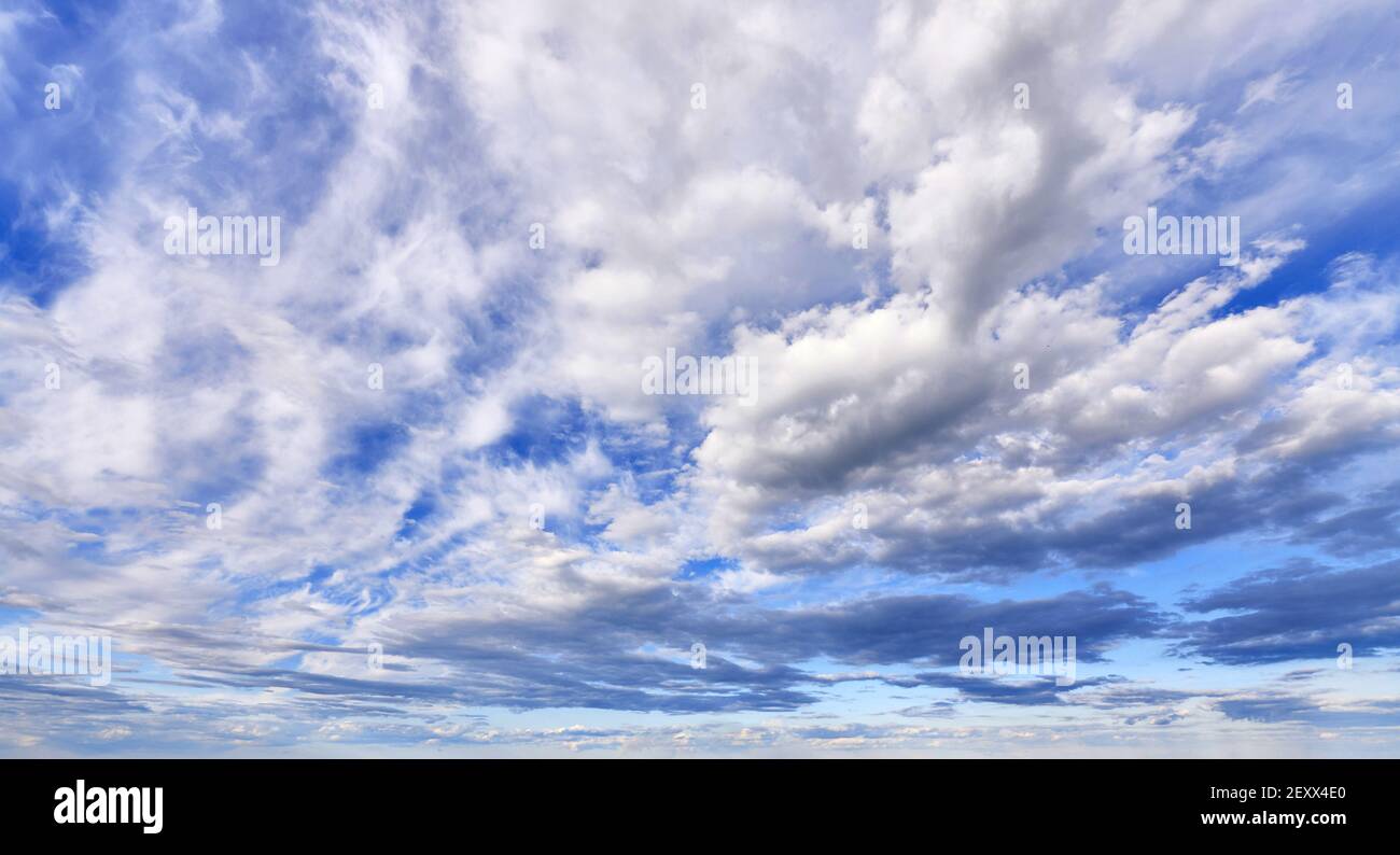 Blue sky with cumulus clouds at daytime Stock Photo - Alamy