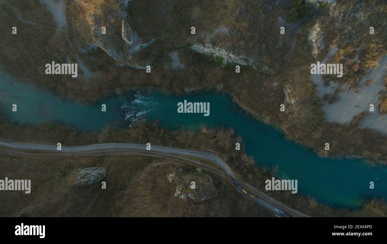 An aerial shot of a blue-water river surrounded by canyons Stock Photo ...