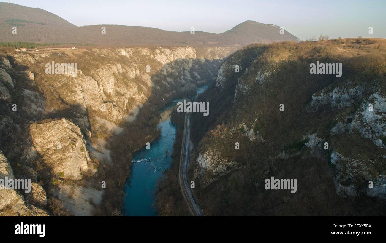 A blue-water river surrounded by canyons and hills Stock Photo - Alamy
