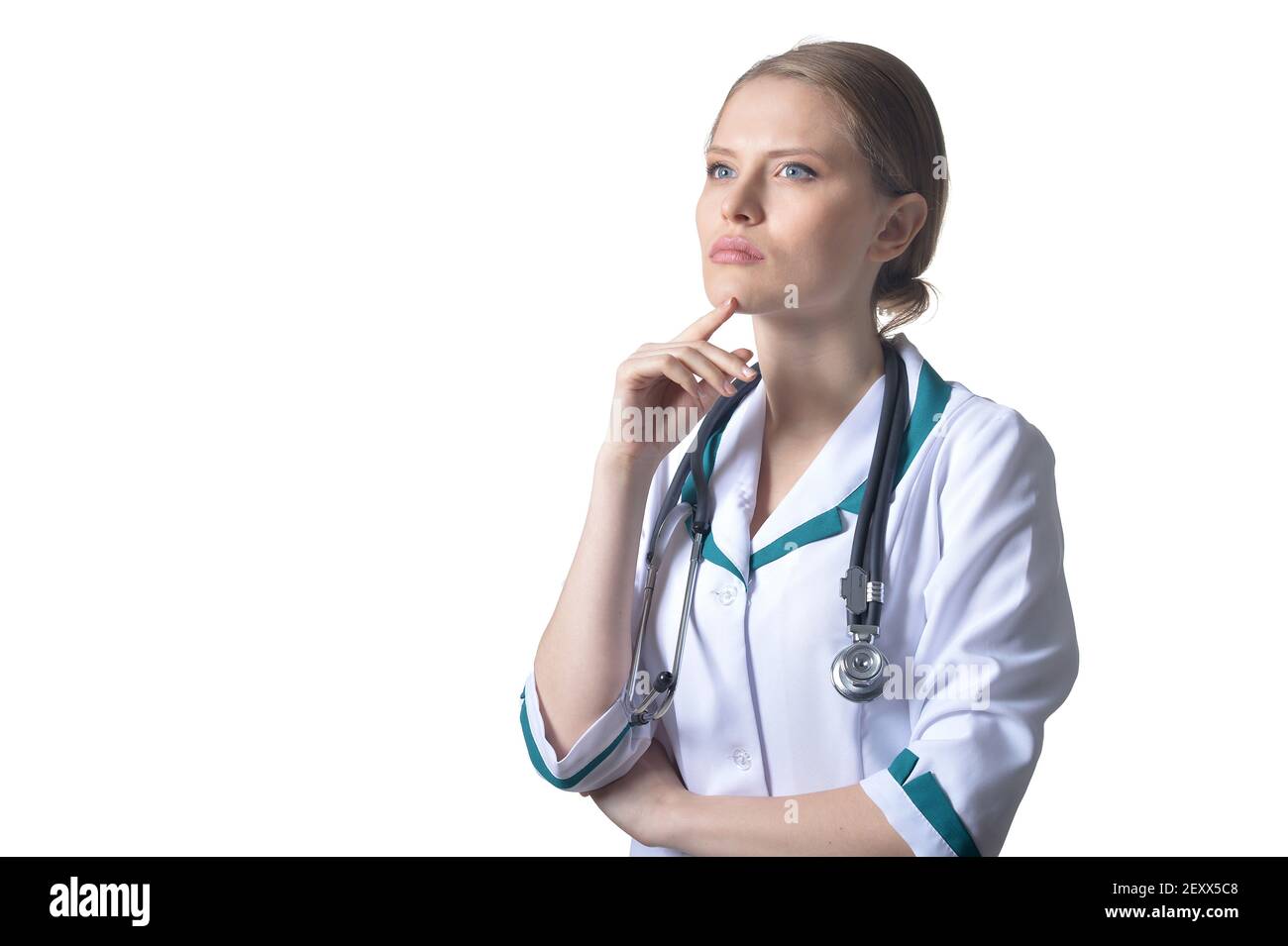 Portrait of female thinking doctor posing on white Stock Photo - Alamy