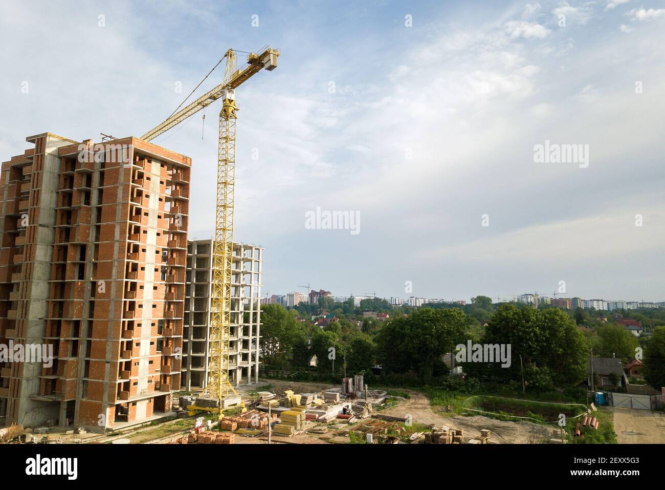 High-rise residential apartment buildings and tower crane under ...
