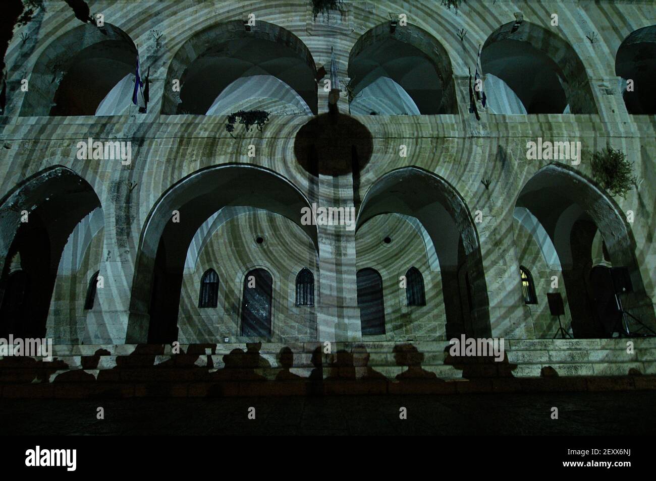 People standing in front of â€œJerusalem Circus of lightâ€ , an art ...