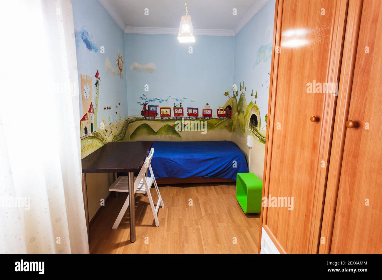 Child painting on floor colorful hi-res stock photography and images ...