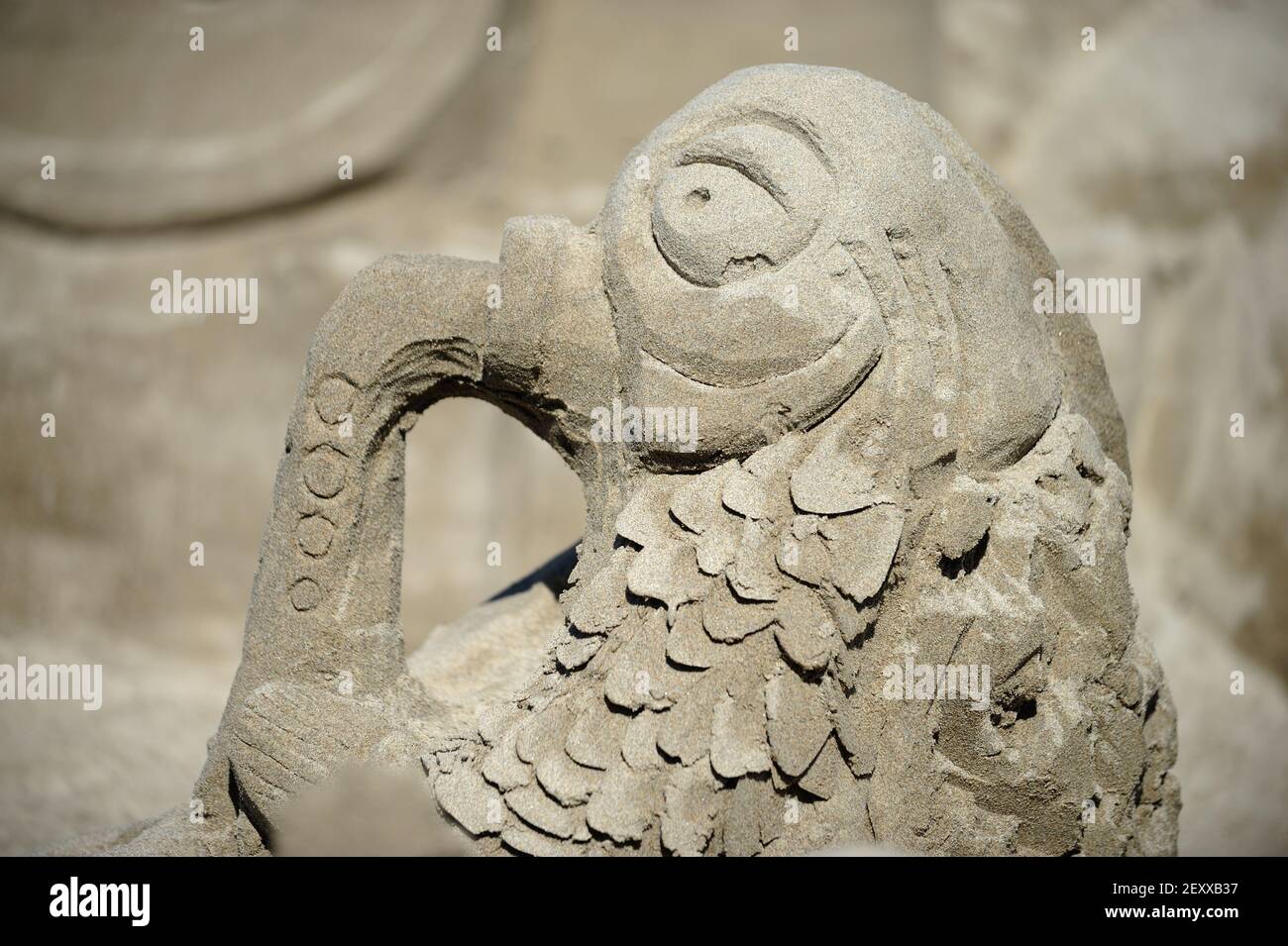 A fish playing a saxophone sculpted out of sand is displayed on Cannon ...