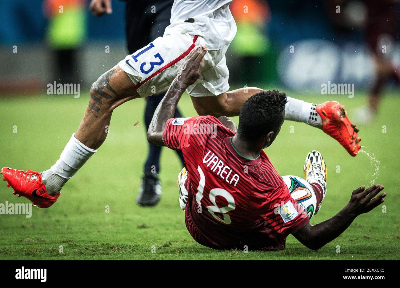 United States' Jermaine Jones (top) passes by Portugal's Varella during ...
