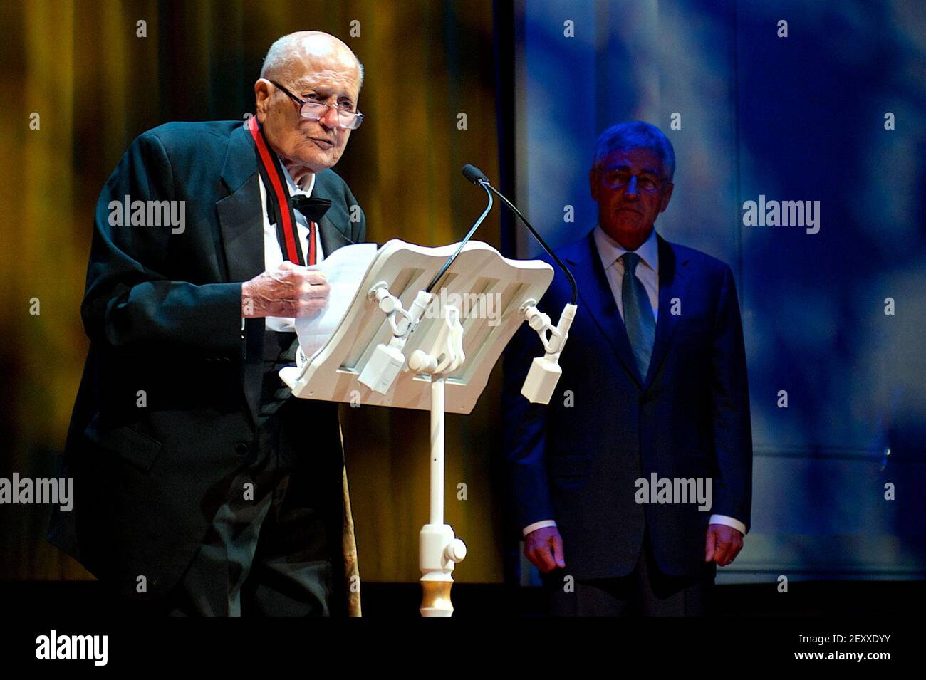 Secretary of Defense Chuck Hagel looks on as The Honorable John D ...