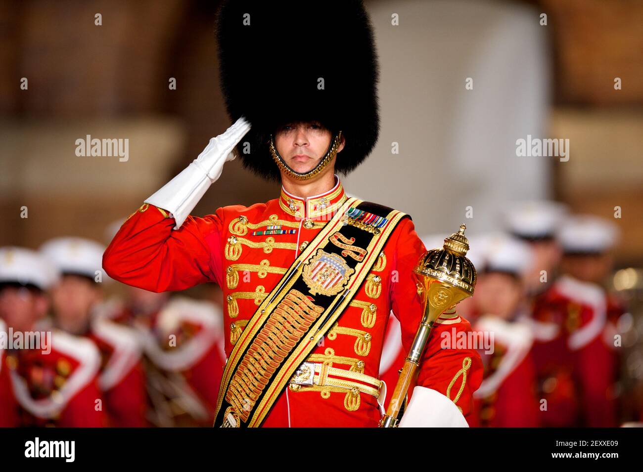 U.S. Marine Band drum major salutes after marching to his position ...