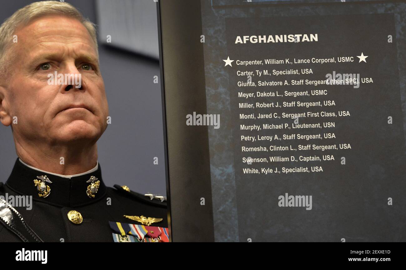 Marine Corps Commandant Gen. James F. Amos looks toward an applauding ...