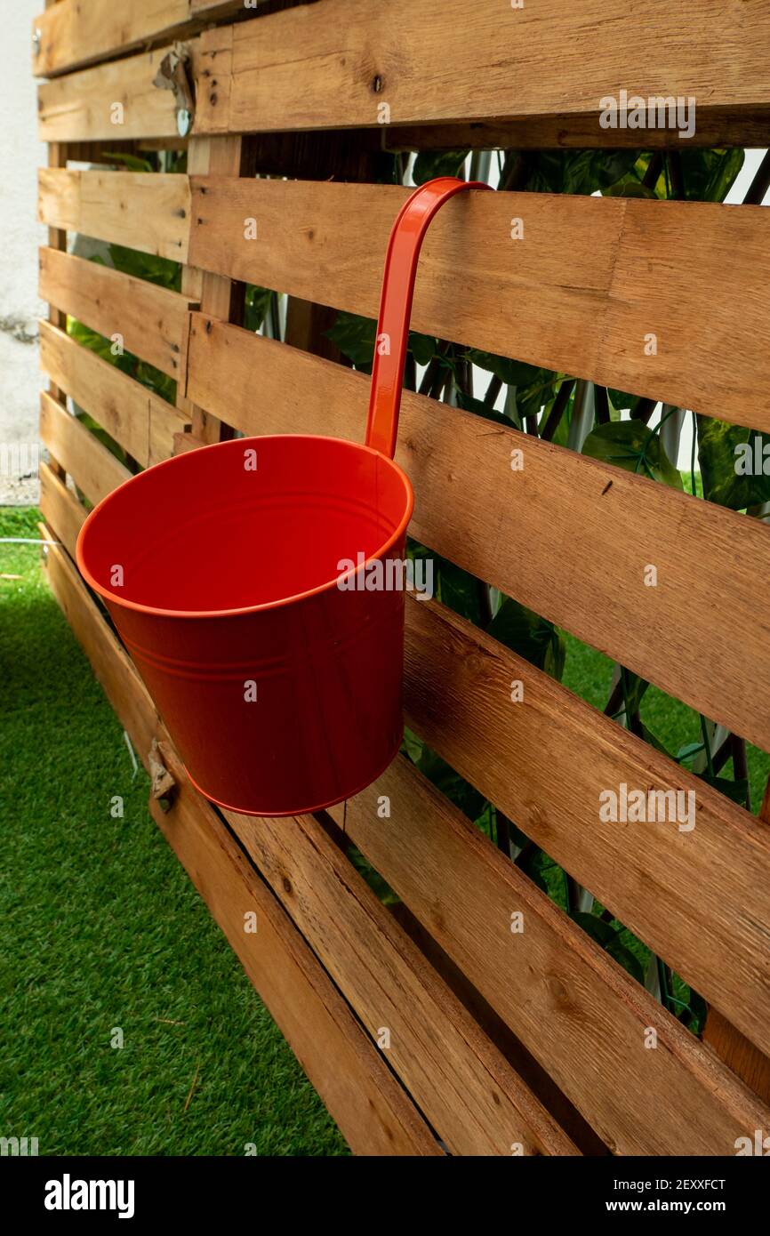 Red Pot Hanging on a Wooden Pallet Background in La Paz, Bolivia Stock ...