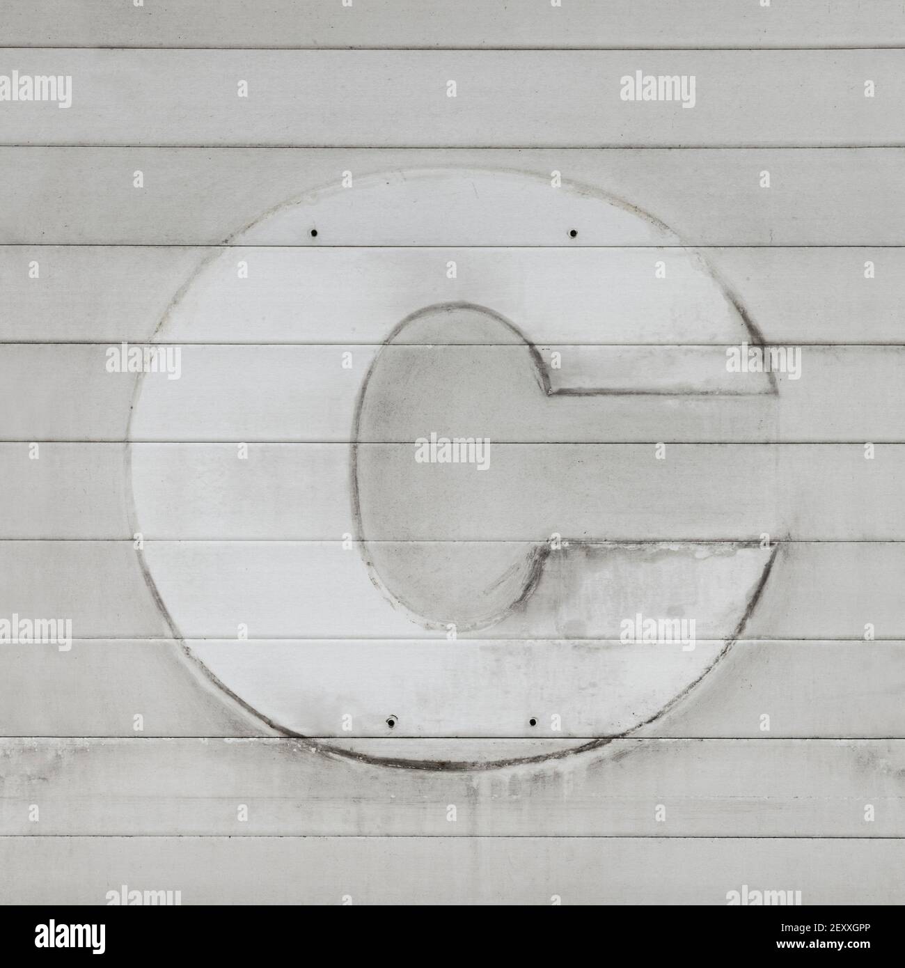 Remains of a lost letter c Stock Photo - Alamy