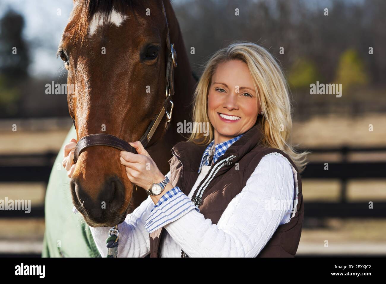 Blonde Model With Horses Stock Photo - Alamy