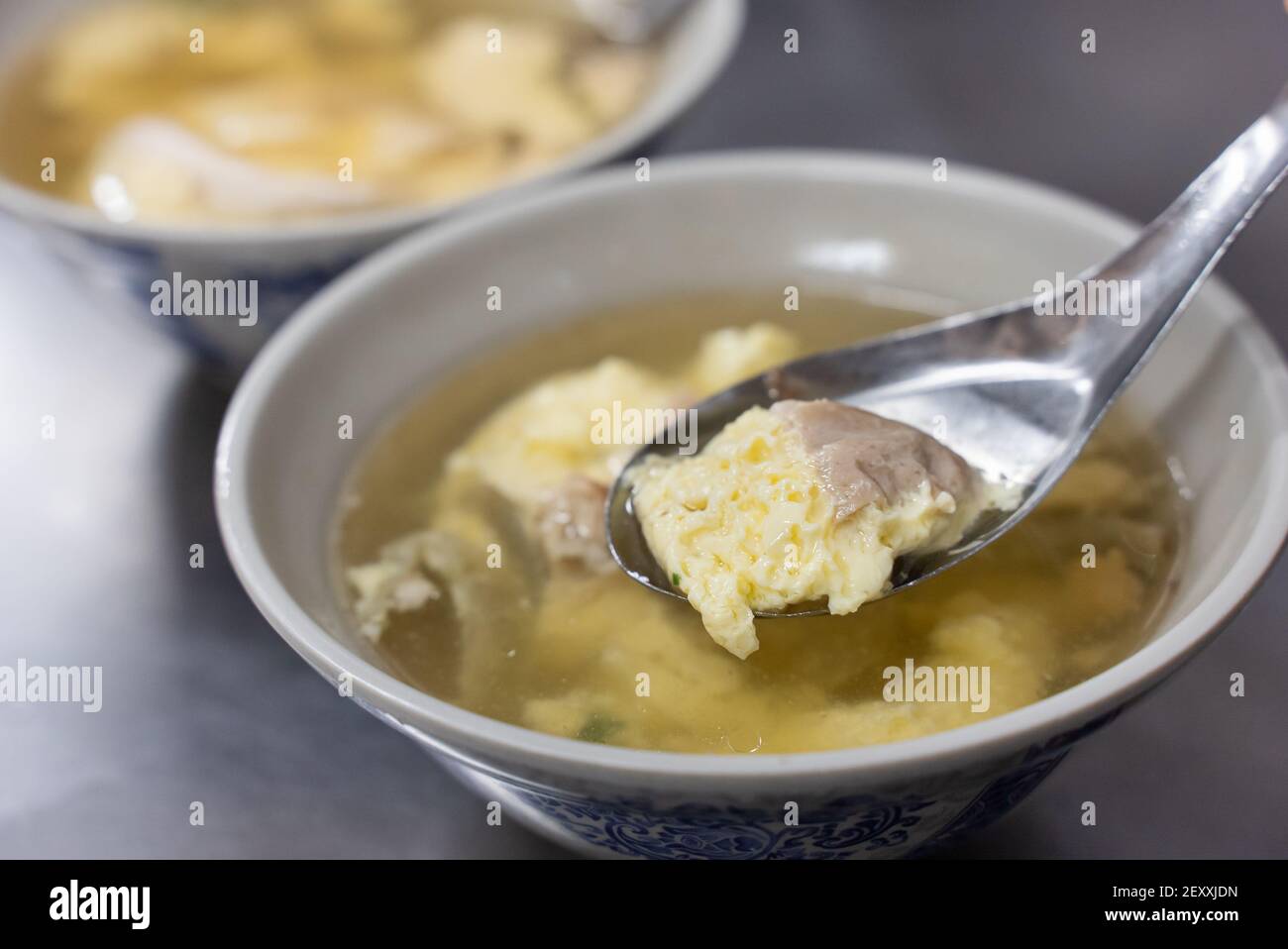 Delicious street food pig bone marrow soup with boiled egg drop in ...
