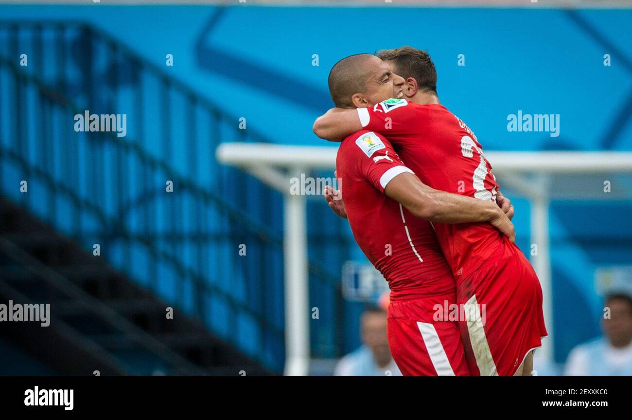 Switzerland's Xherdan SHAQIRI (R) celebrates after scoring a goal ...