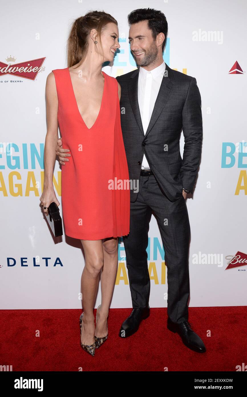 (L-R) Model Behati Prinsloo and musician Adam Levine attend the "Begin ...