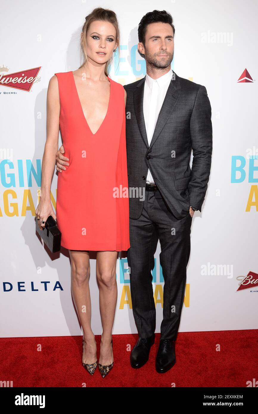 (L-R) Model Behati Prinsloo and musician Adam Levine attend the "Begin ...