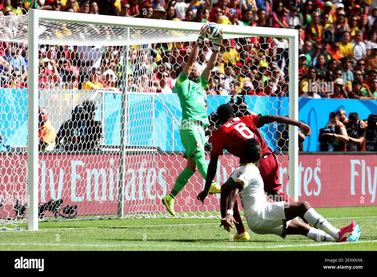 Portugal's goalkeeper BETO (top) grabbing the ball during the group G ...