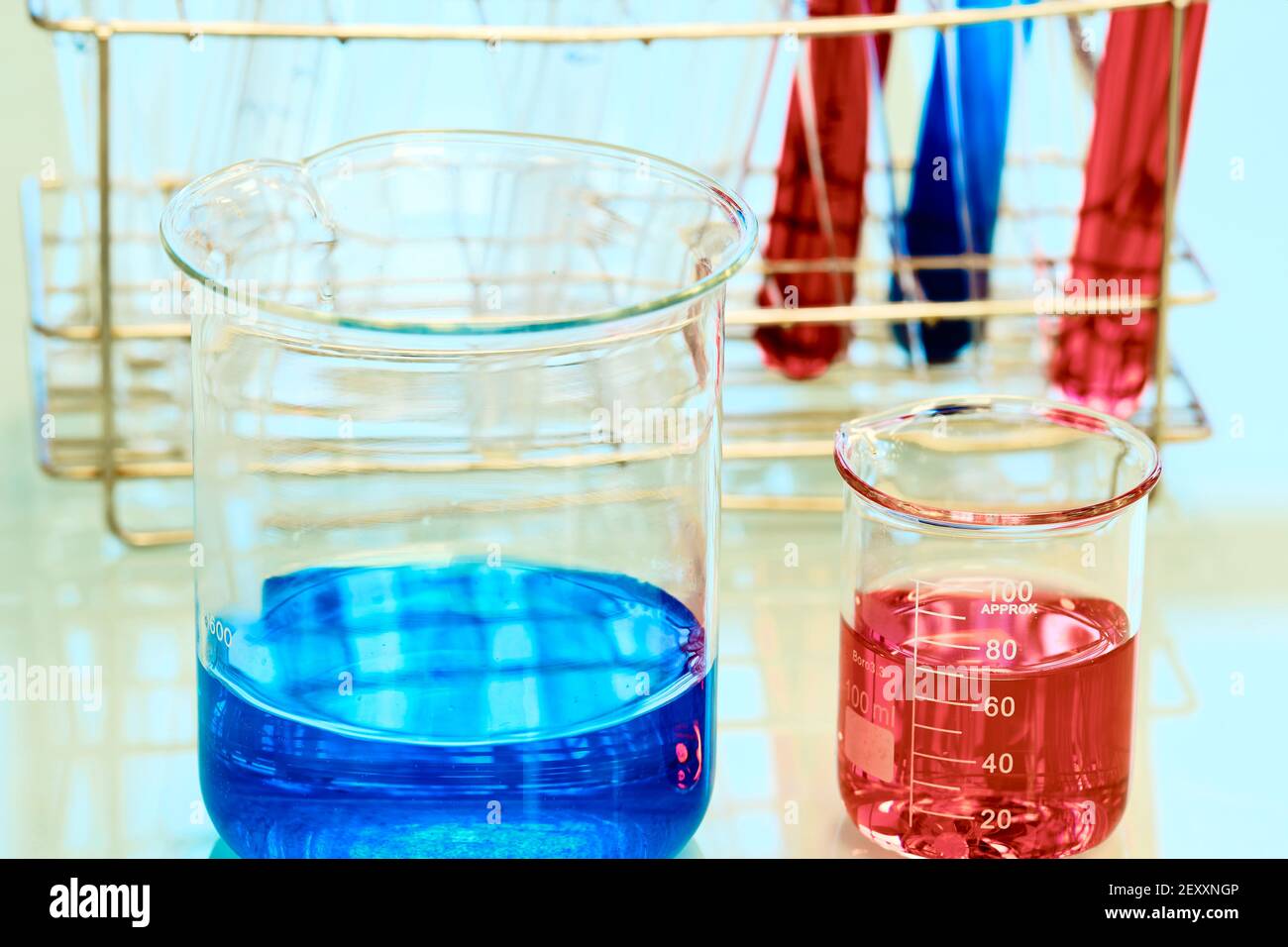 Glass flask and test tubes with liquids in a scientific laboratory ...