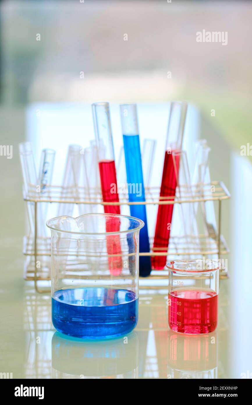 Glass flask and test tubes with liquids in a scientific laboratory ...