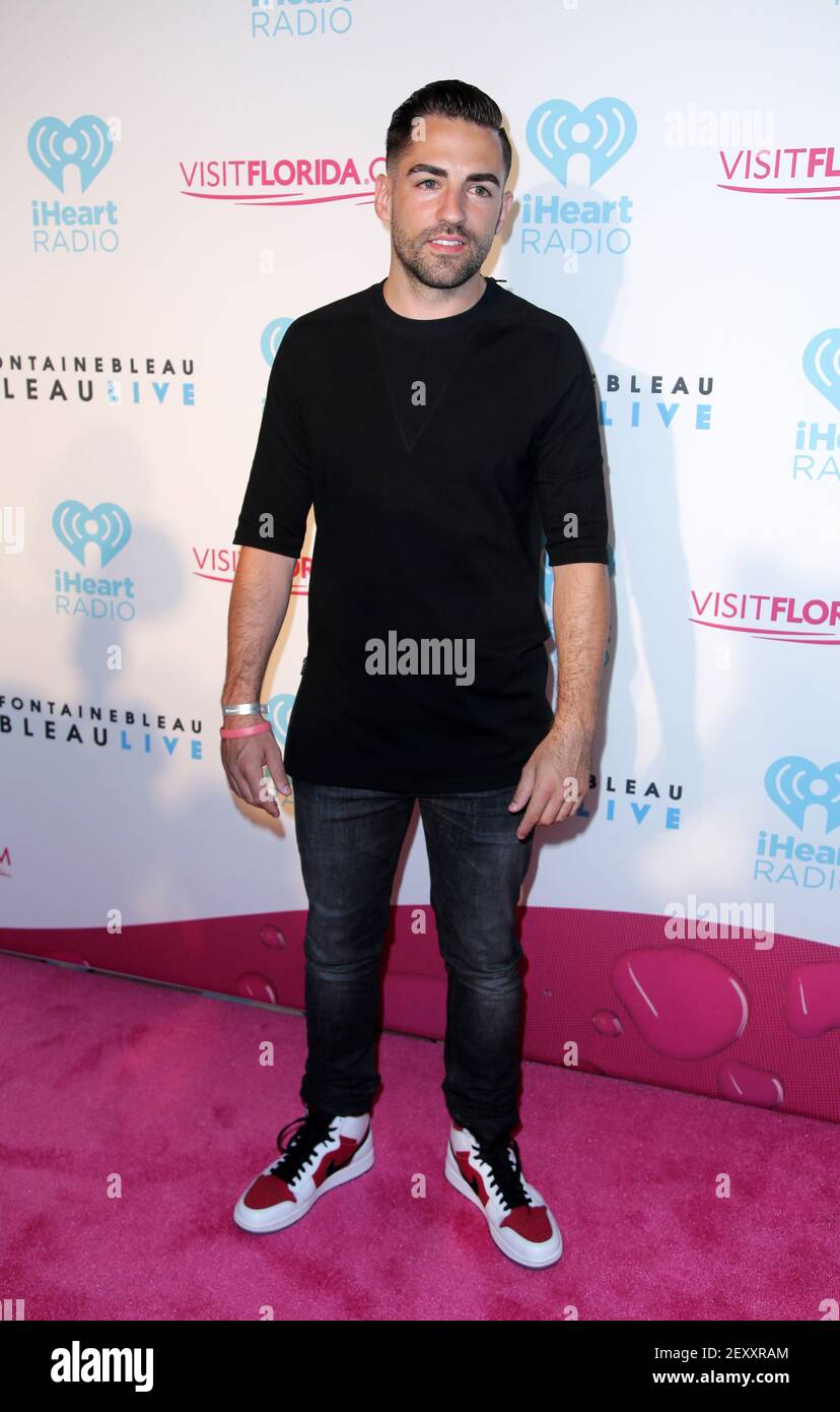 DJ E.V. attends the iHeartRadio Ultimate Pool Party presented by VISIT ...