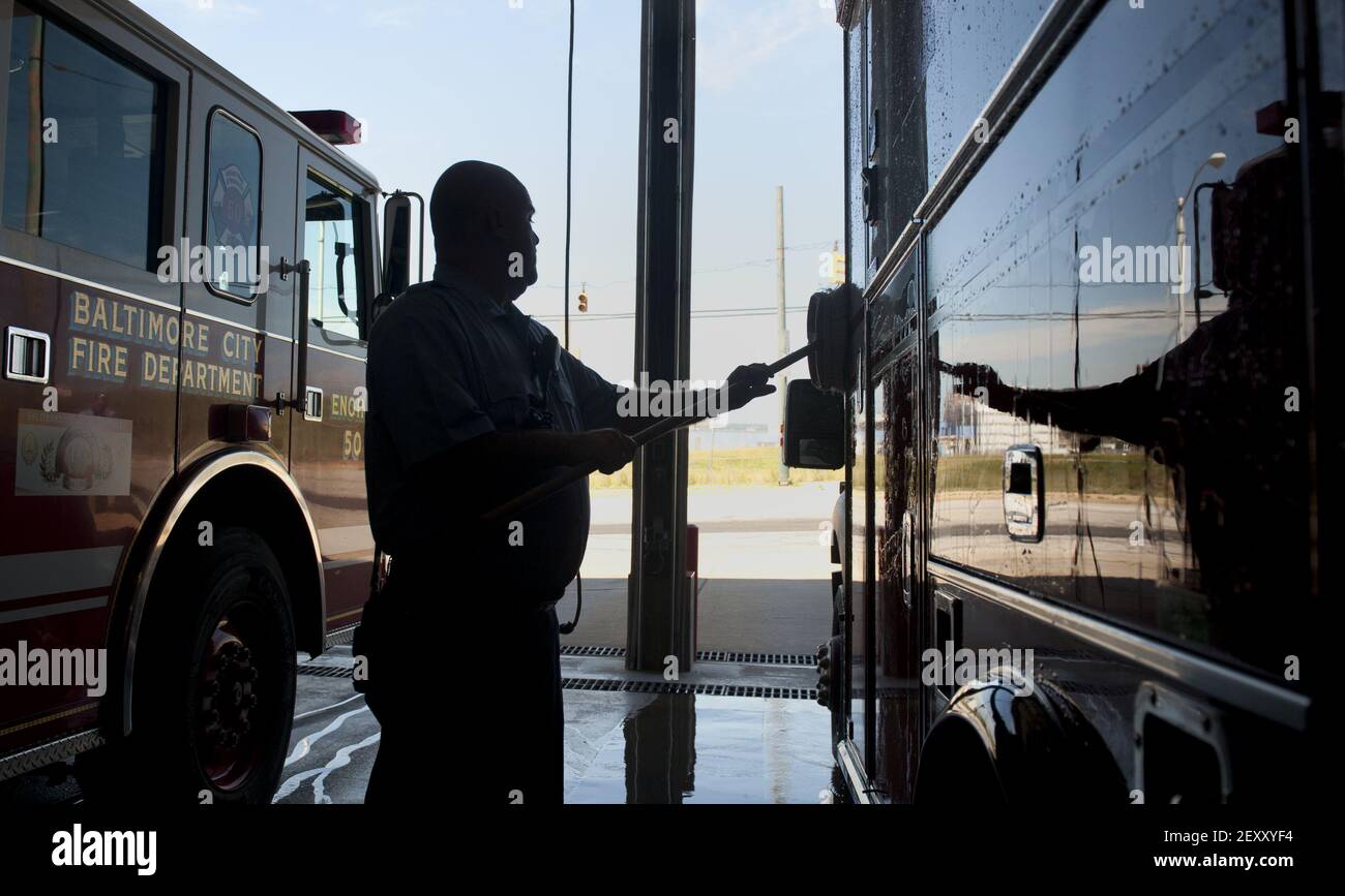 Michael Wille a firefighter and medic washes the trucks during some ...