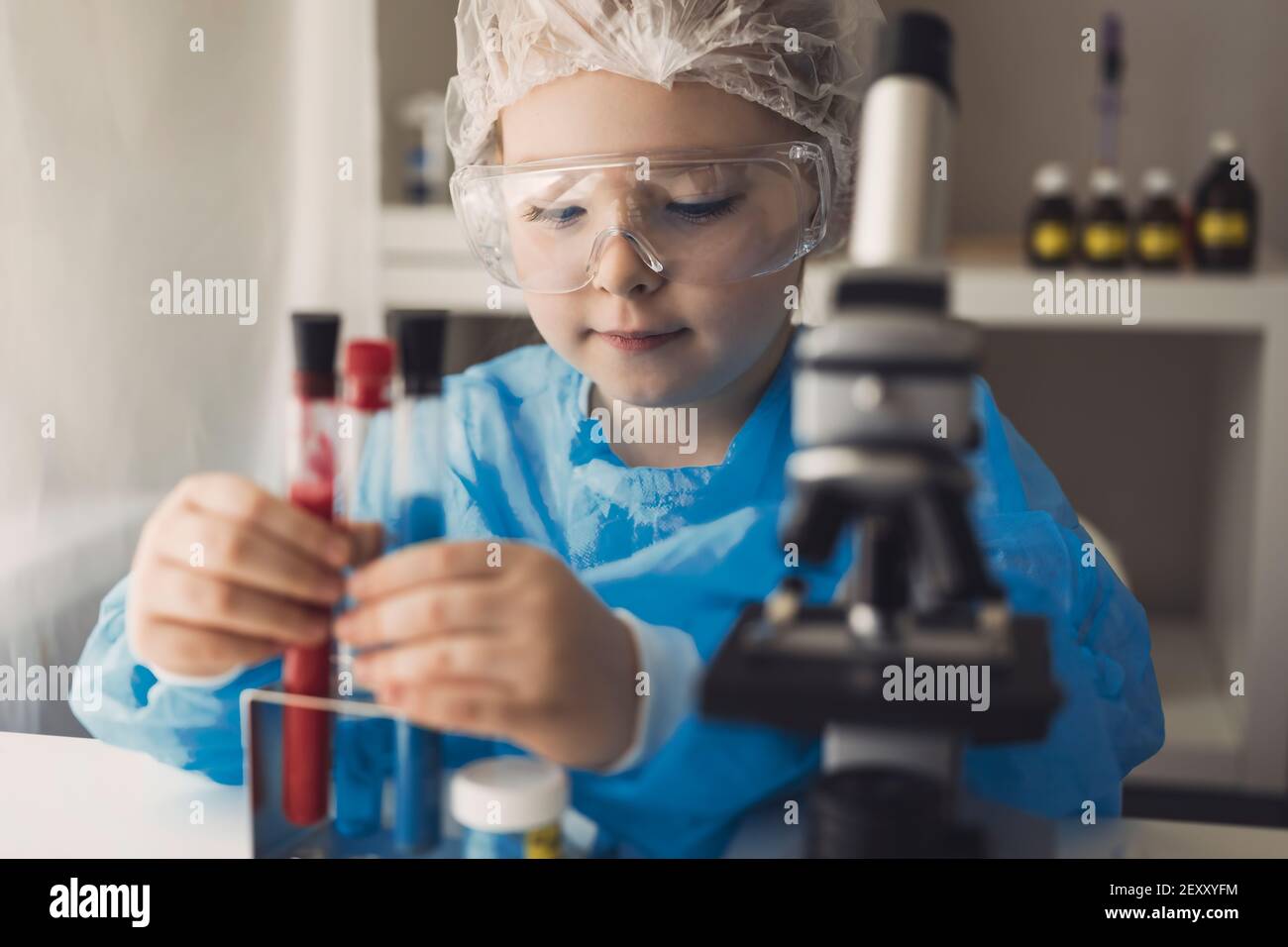 Girl in lab coat hi-res stock photography and images - Alamy