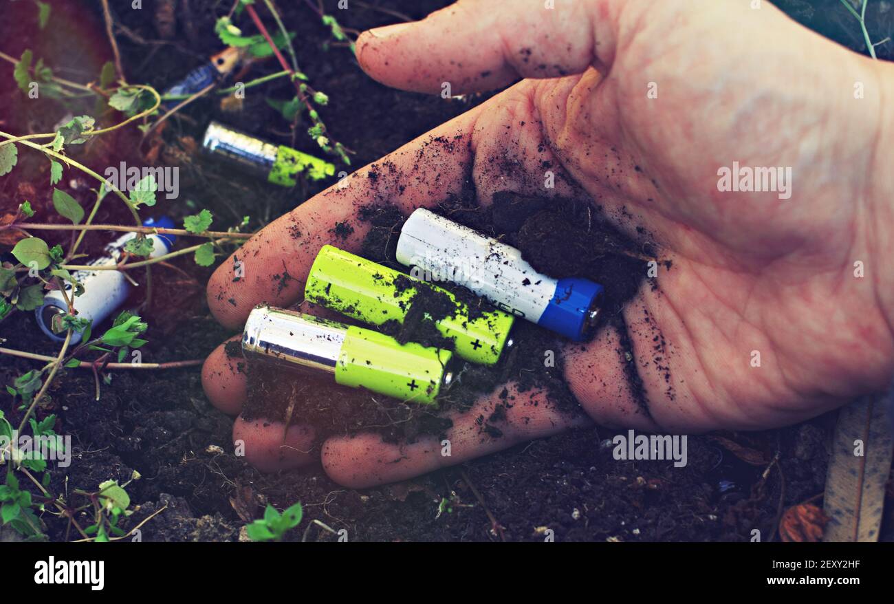 batteries on ground, concept of toxic waste Stock Photo - Alamy