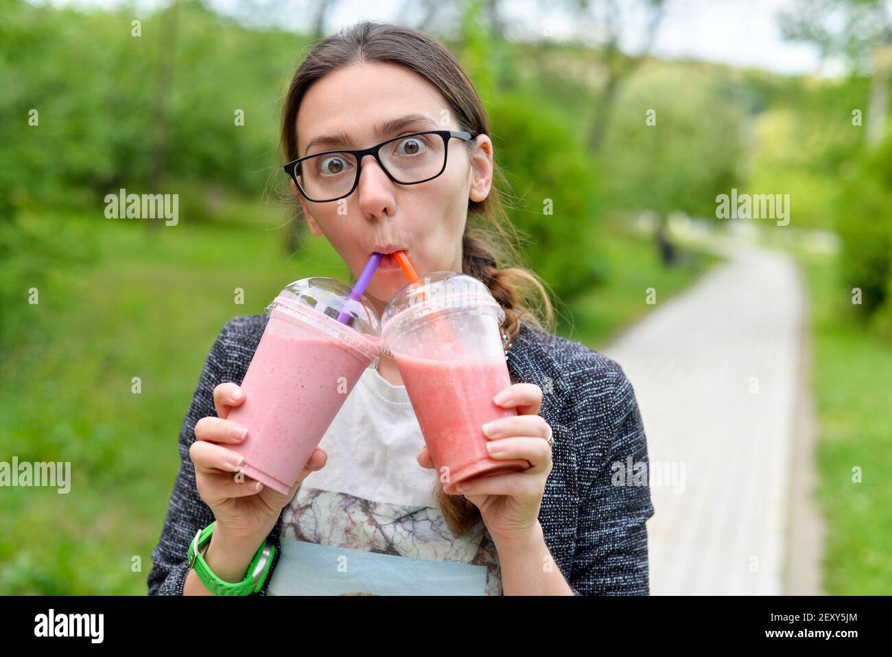 Woman drinking smoothie outside hi-res stock photography and images - Alamy